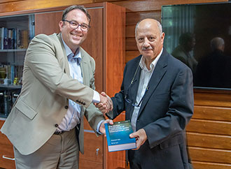 Dr Christopher Soler presents his publication to UM Rector - Newspoint ...